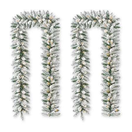 Click here for Glitzhome 2pc 6ft Pre-Lit Flocked Indoor Christmas... prices
